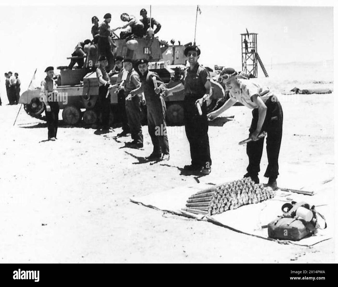 TANKS IN THE DESERT - Loading one of the tanks with ammunition ...