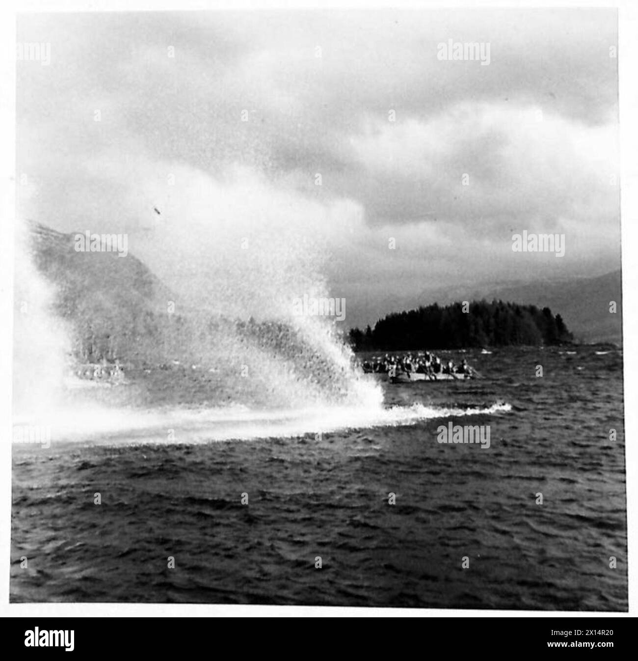 Commandos make an opposed landing under simulated enemy fire while ...