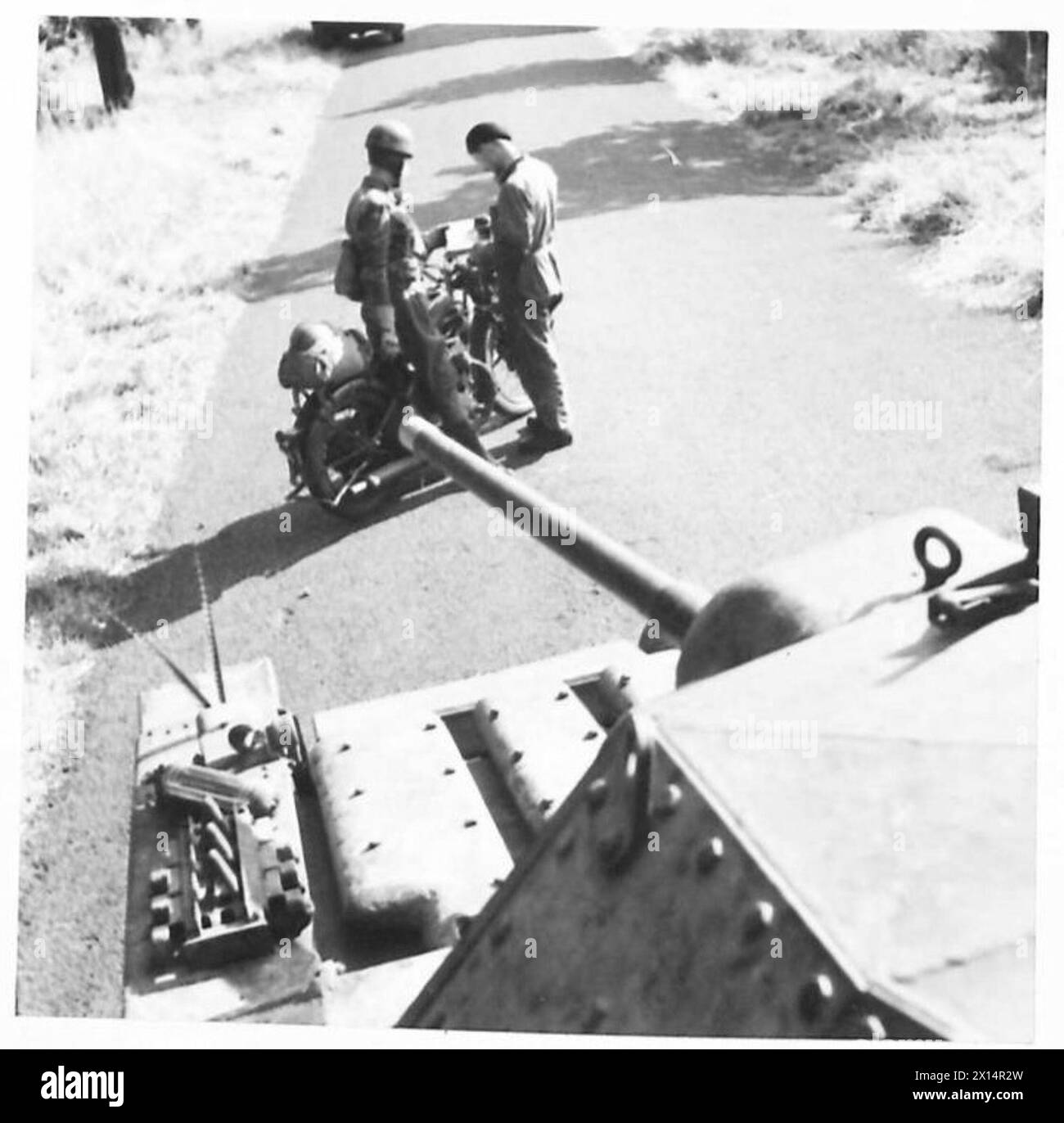 TANKS HAVE SPECIAL POLICE - A tank driver checks up with a policeman as ...