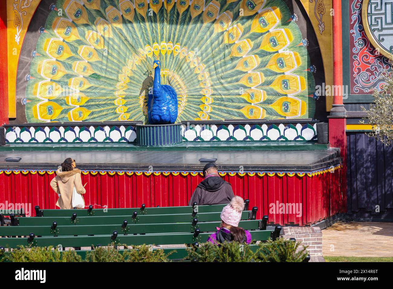 Chinese-style pantomime theatre with large peacock and empty theater ...