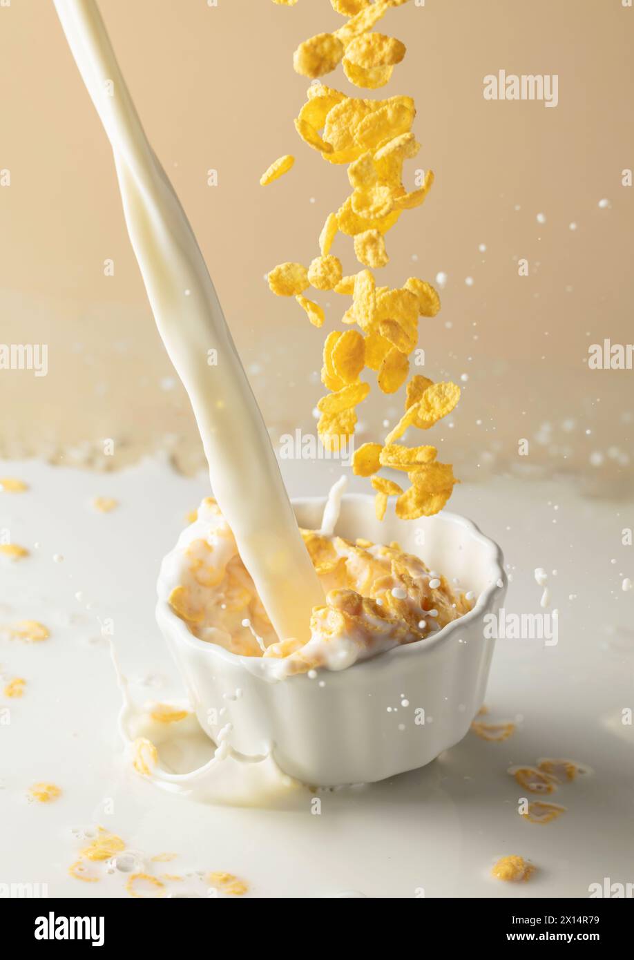 Milk pouring into a bowl with cornflakes hi-res stock photography and ...