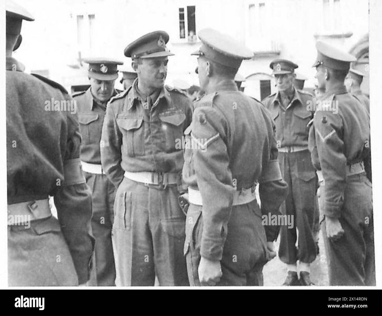 General Templar speaks with a Military Policeman during an inspection ...