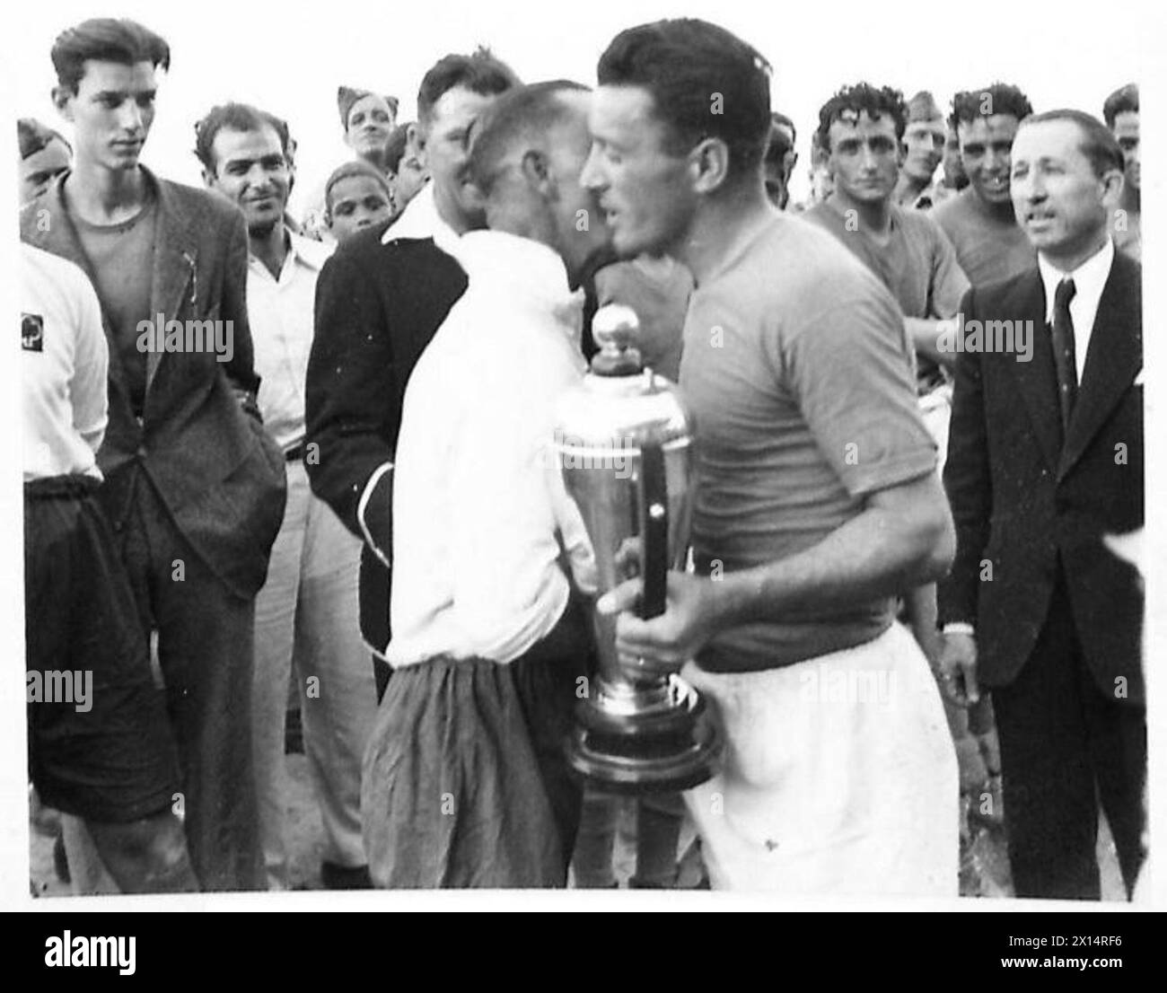 Azzopardi, captain of Tunis, embraces Mark Hooper, captain of the 1st ...