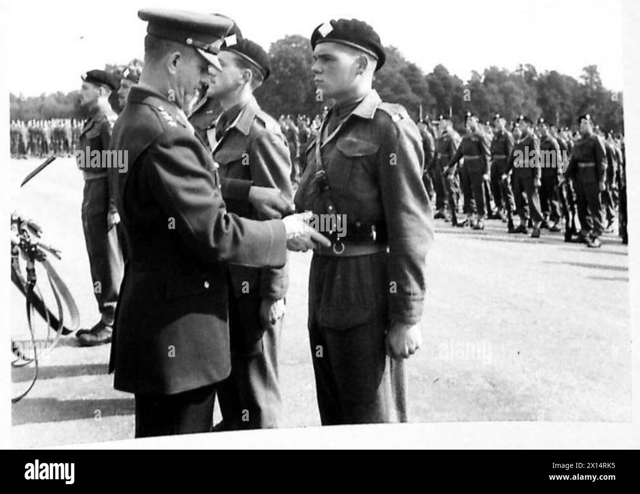 Lt. Gen. J. L. Devers takes the salute at a passing-out parade and ...