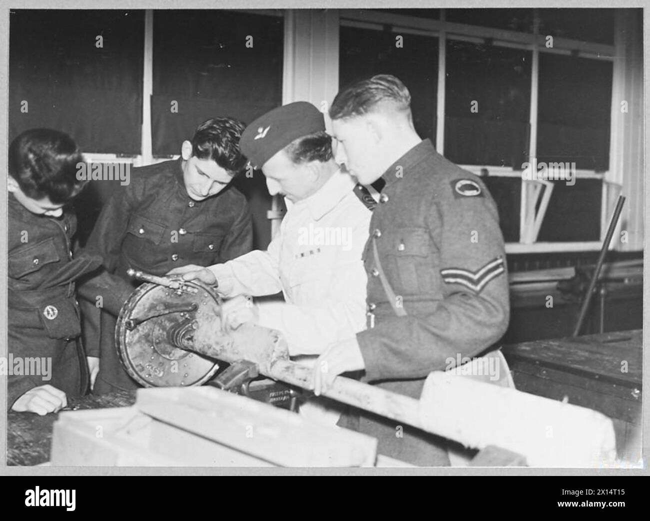Air Training Corps cadets repair the landing gear of an aircraft on ...