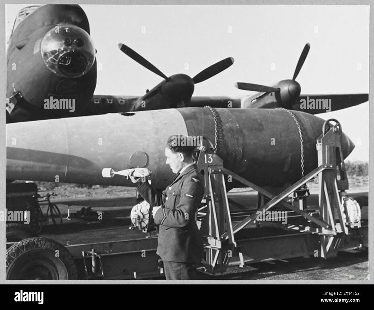 PICTURE TAKEN WHEN A 10-TON BOMB WAS BEING LOADED ON TO A LANCASTER ...