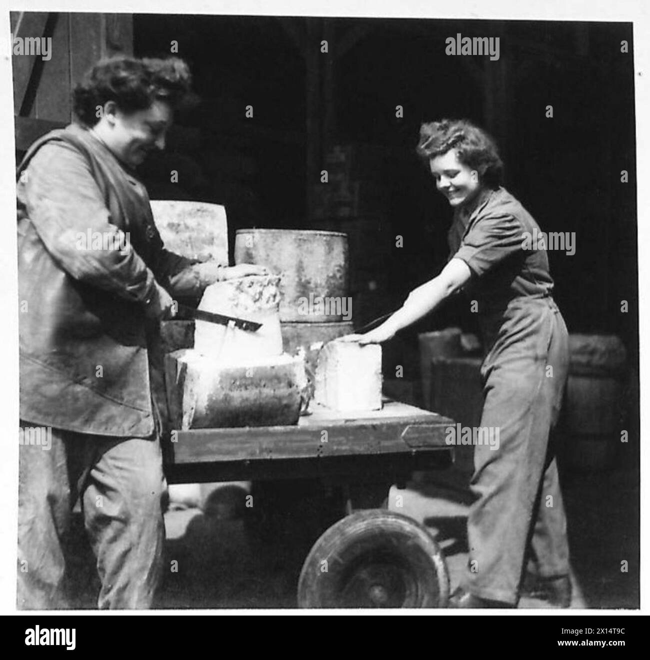 Cutting cheeses Black and White Stock Photos & Images - Alamy
