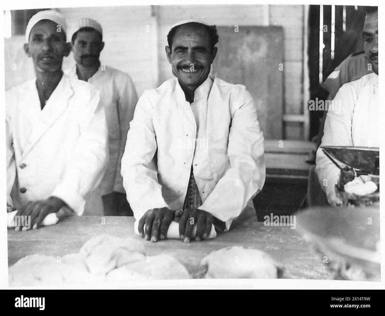 A FIELD BAKERY IN THE DESERT - A typical Egyptian master baker employed ...