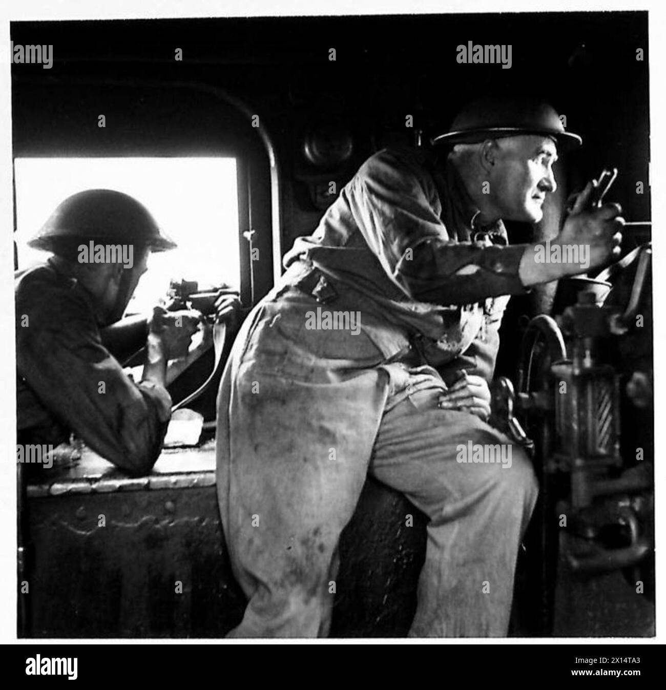 HOME GUARD'S ARMOURED TRAIN - Private James Cunningham [left] firing ...