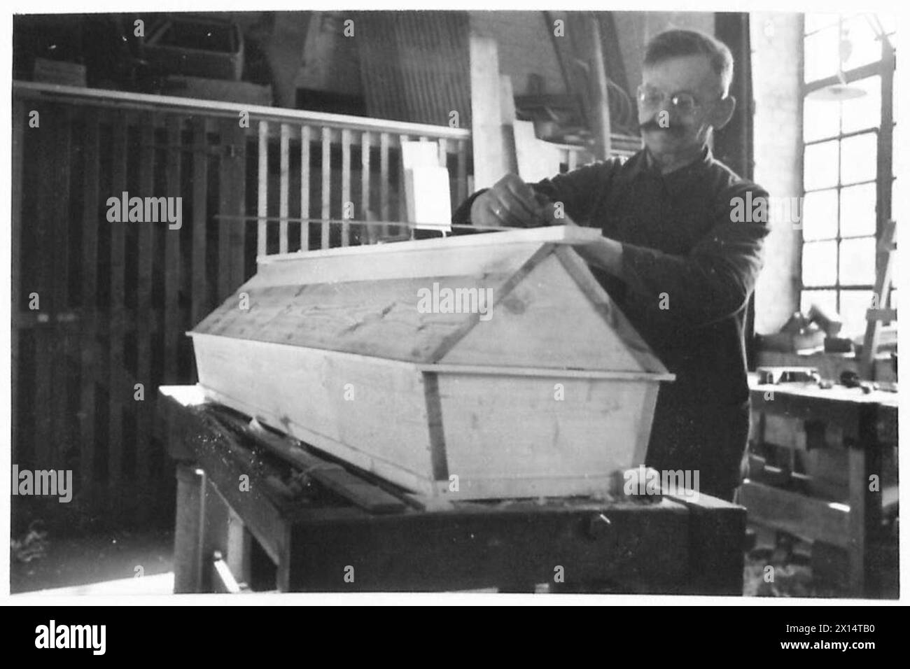 MILITARY GOVERNMENT GOES INTO ACTION - Carpenters are making coffins at ...