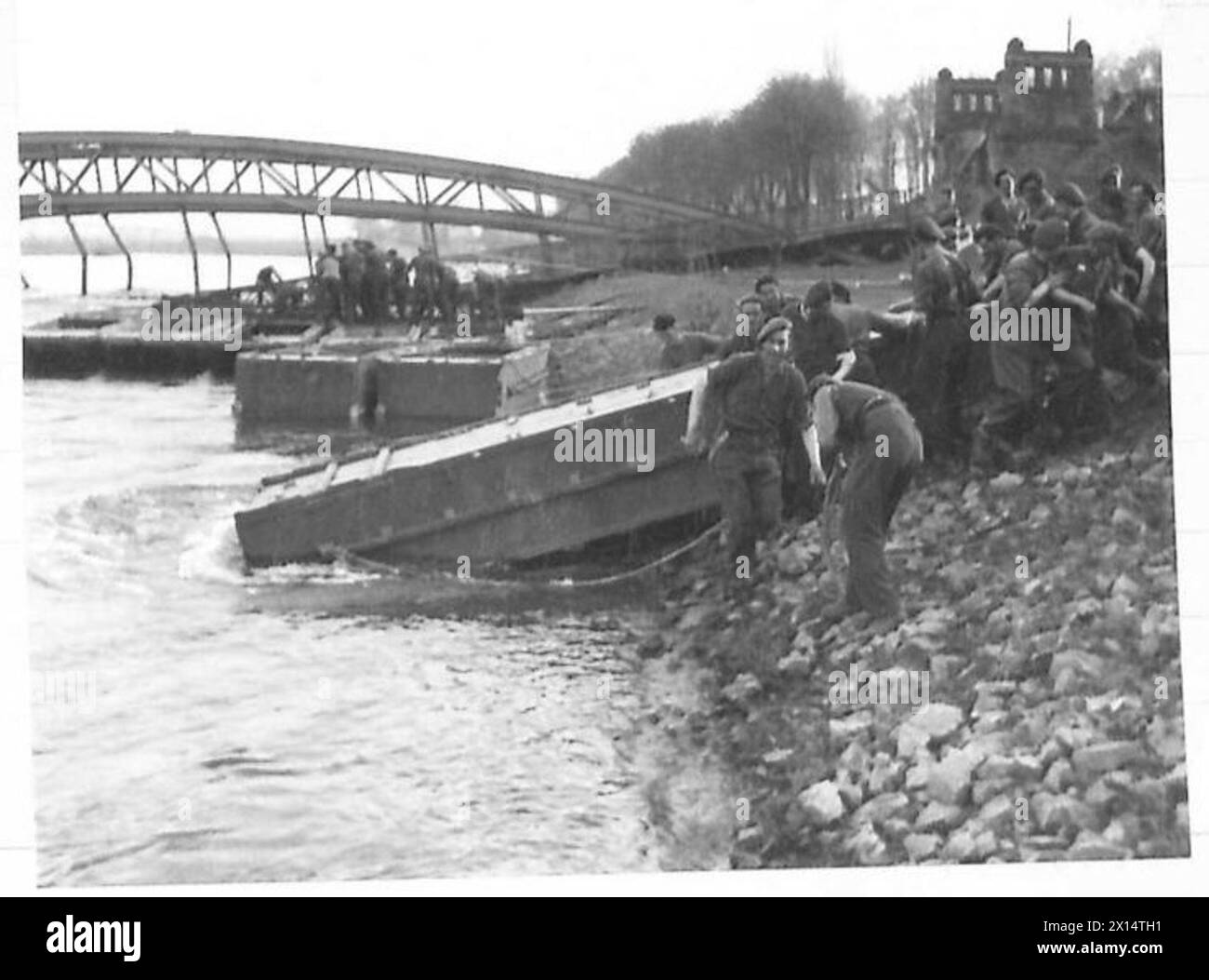 BRIDGING THE WESER - Launching pontoons. The blown bridge in the ...