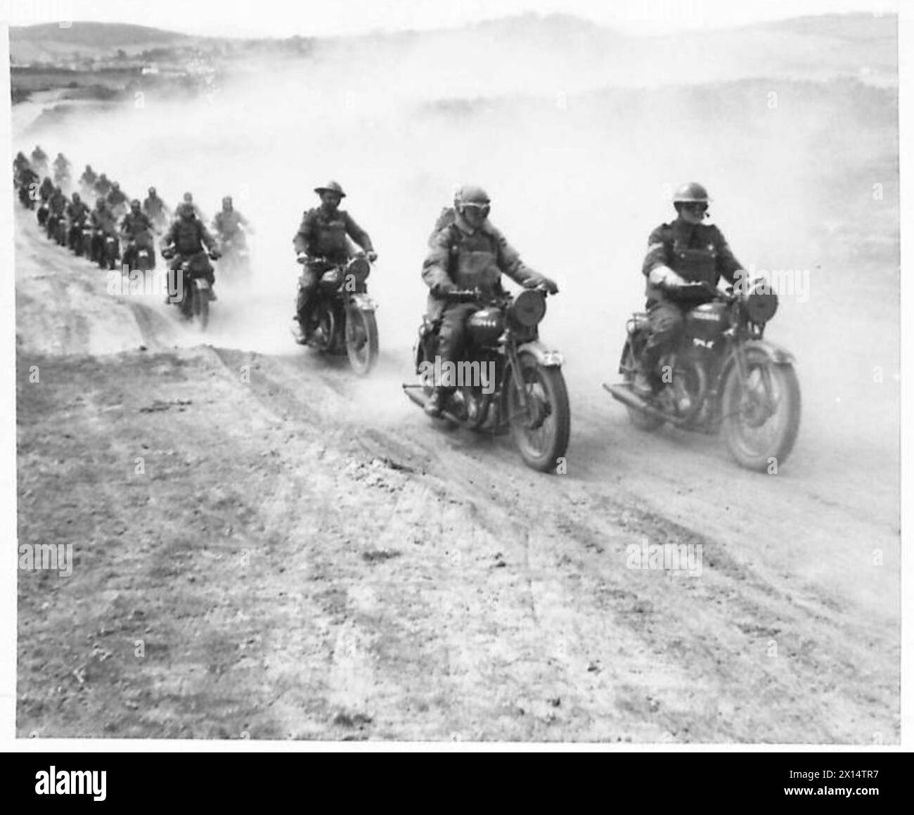 THE RECONNAISSANCE CORPS IN ACTION - Raising the dust. A motor cycle ...