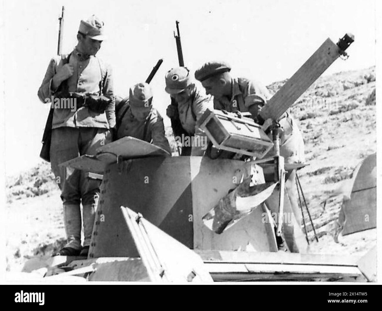 Turkish troops examine the turret of a British armored car patrolling ...