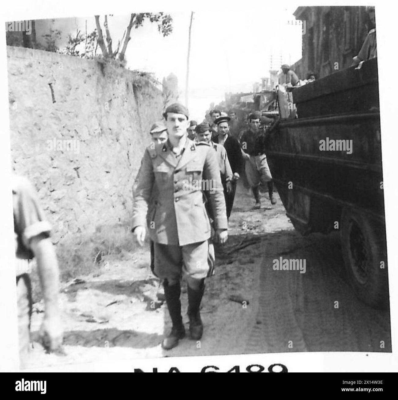Italian prisoners of war march past a British amphibious vehicle at ...
