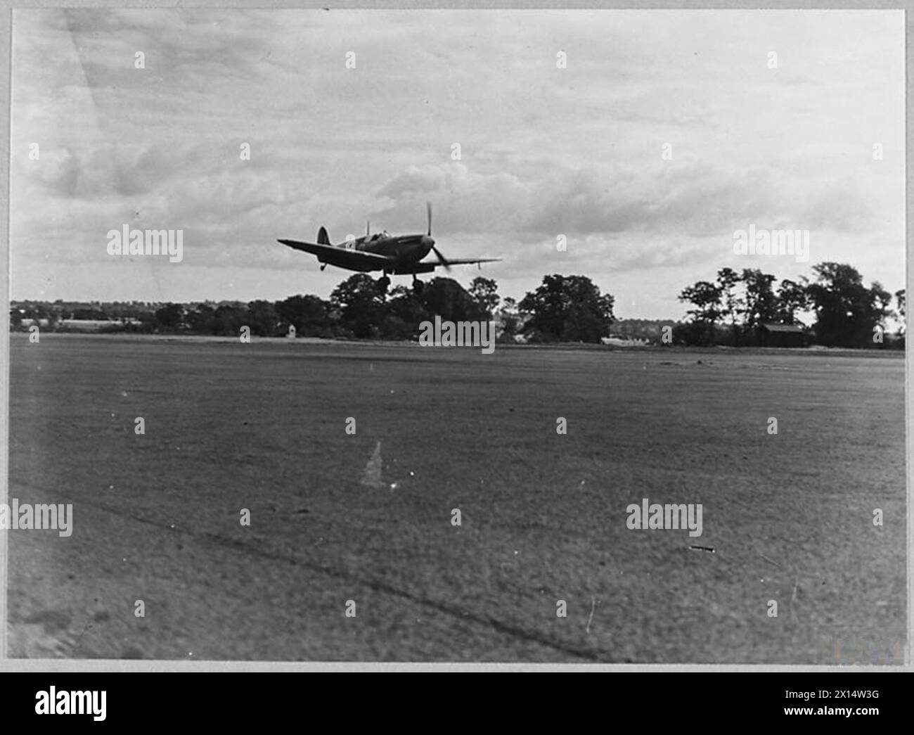 ROYAL AIR FORCE AIRCRAFT - Spitfire F Mk.2 about to touch down at 61 ...