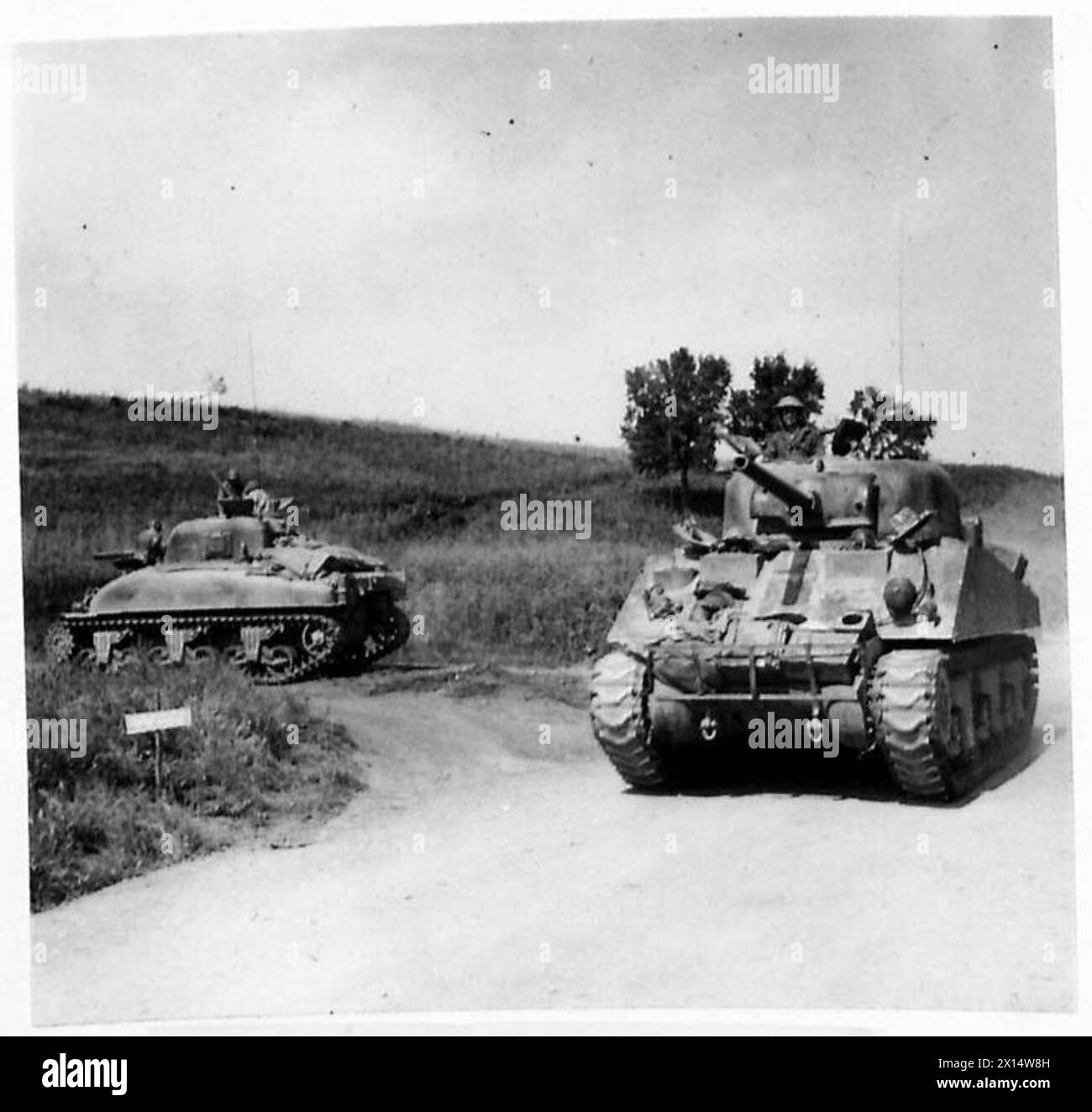 FIFTH ARMY : VARIOUS - The Sherman OP tank passes an American Sherman ...