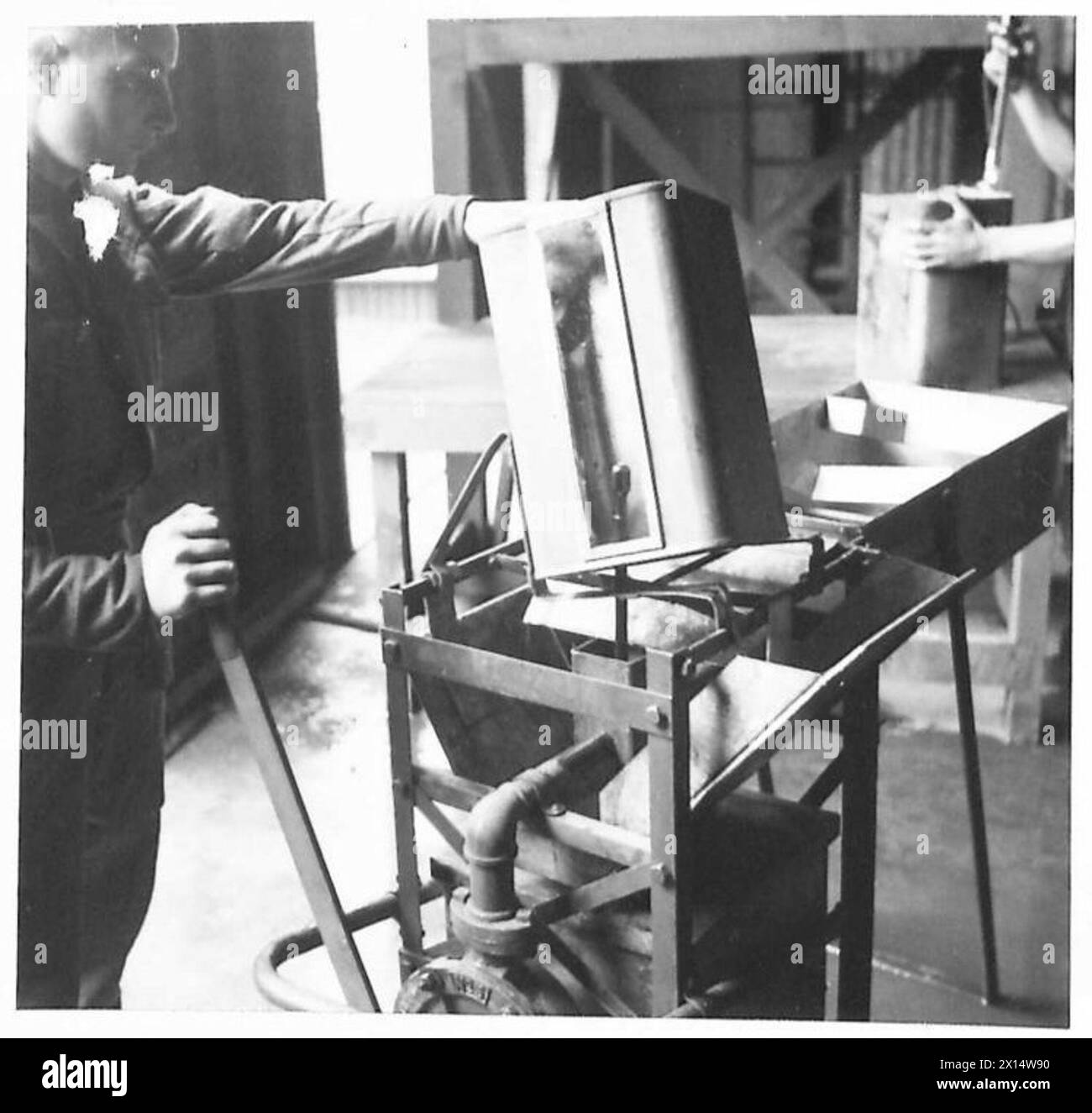 A petrol tin with glass panels is used at a base depot to maintain ...