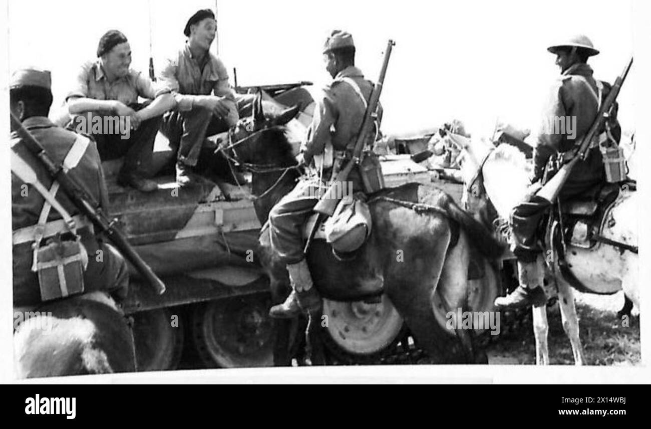 ENFIDAVILLE - Men of "A" Squadron 8th Armoured Brigade chat to to ...