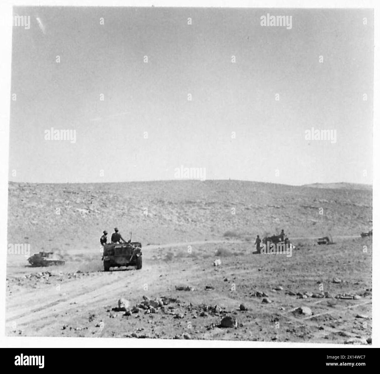 Indian troops are shown in a Bren gun carrier entering a captured wadi ...