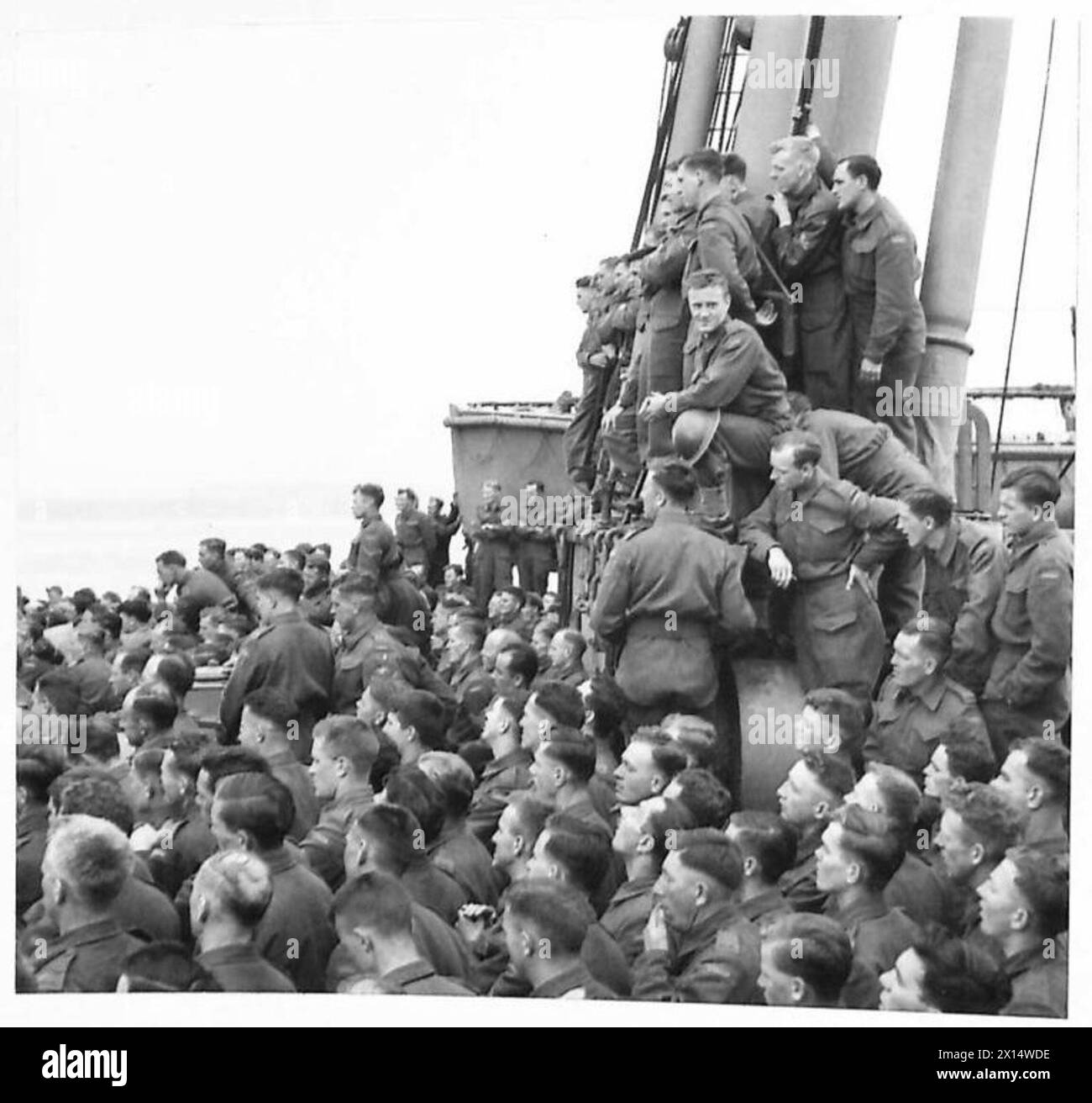 MORE CANADIAN TROOPS ARRIVE - Some of the men listen to an address of ...