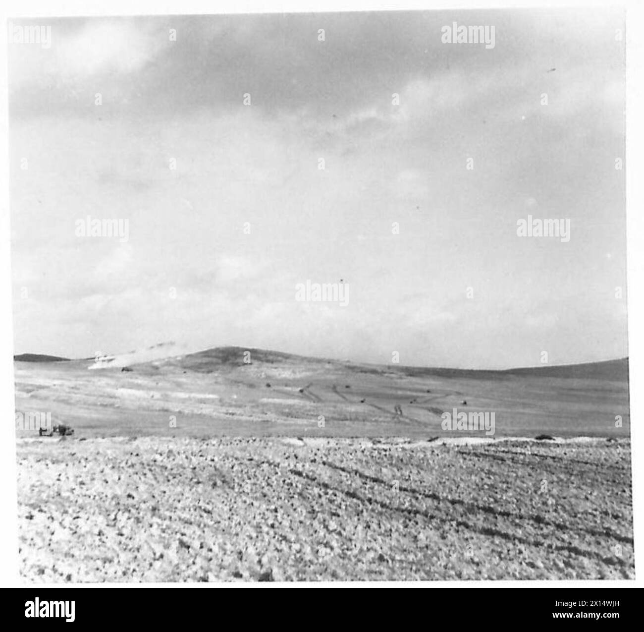 Crusader Mk. III tanks of the 17th/21st Lancers advance on a hill ...