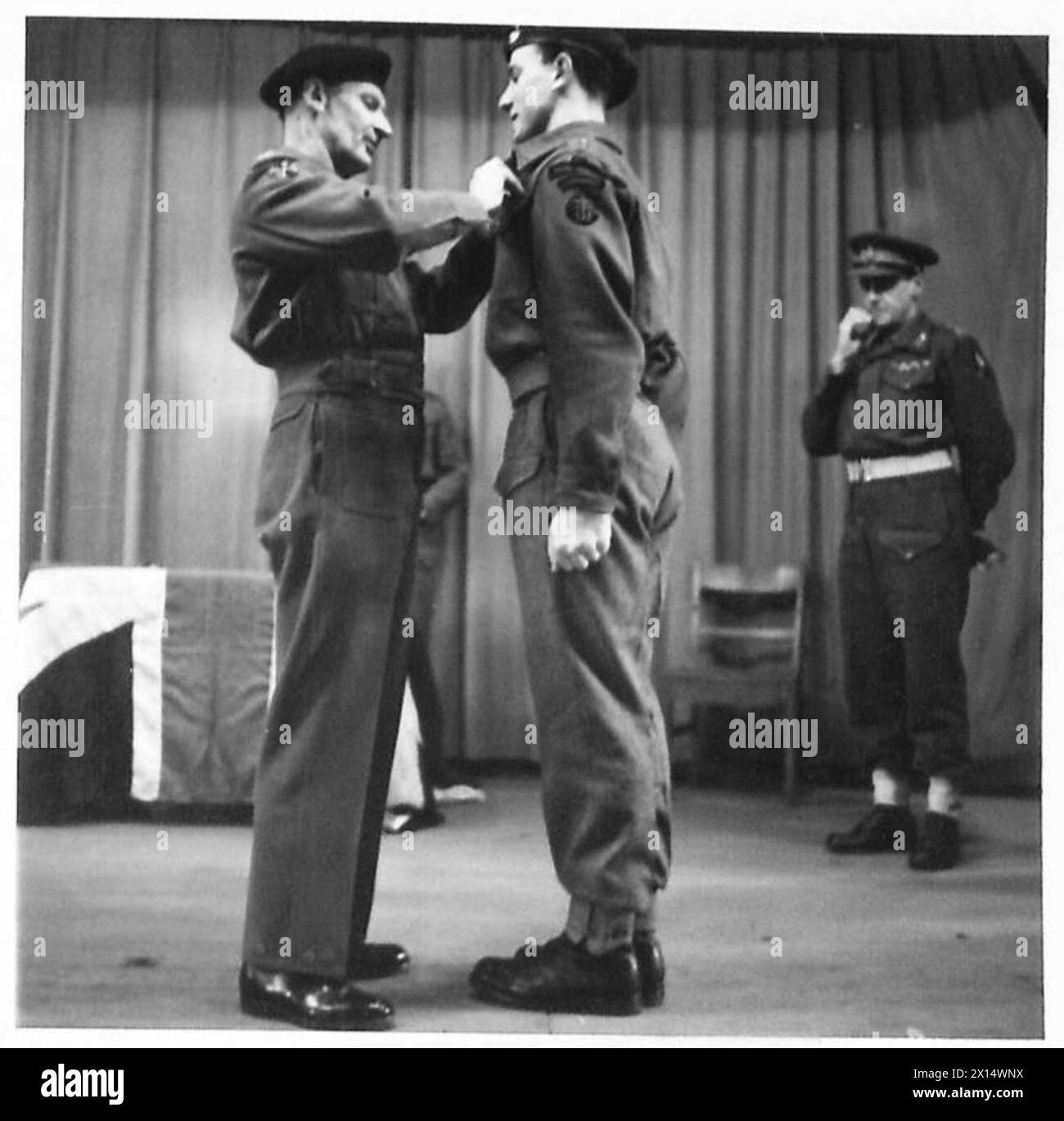 INVESTITURE BY FIELD MARSHAL MONTGOMERY - Lt Riley RM CDO receives the ...