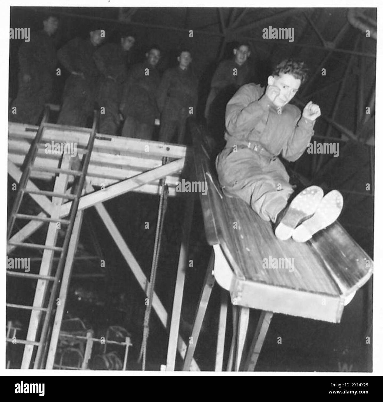 British Army paratroop recruits are instructed in correct falling and ...