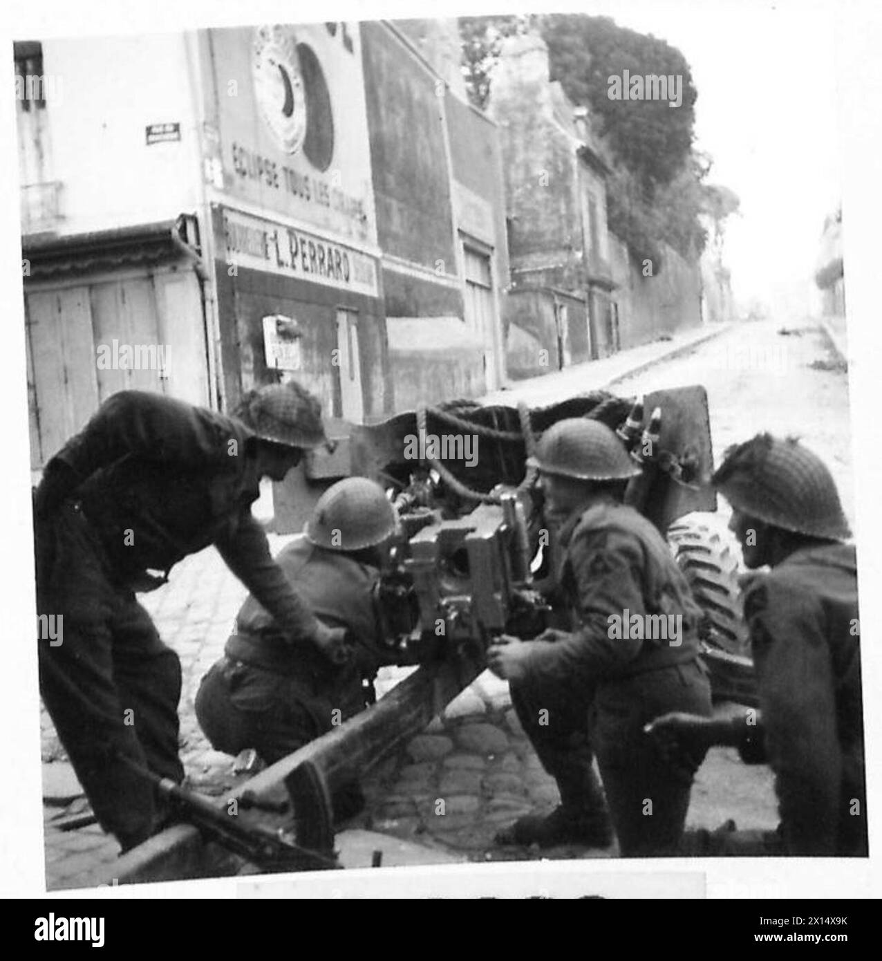 THE ENTRY INTO CAEN - An Anti-tank gun covers a Caen street, 3rd ...