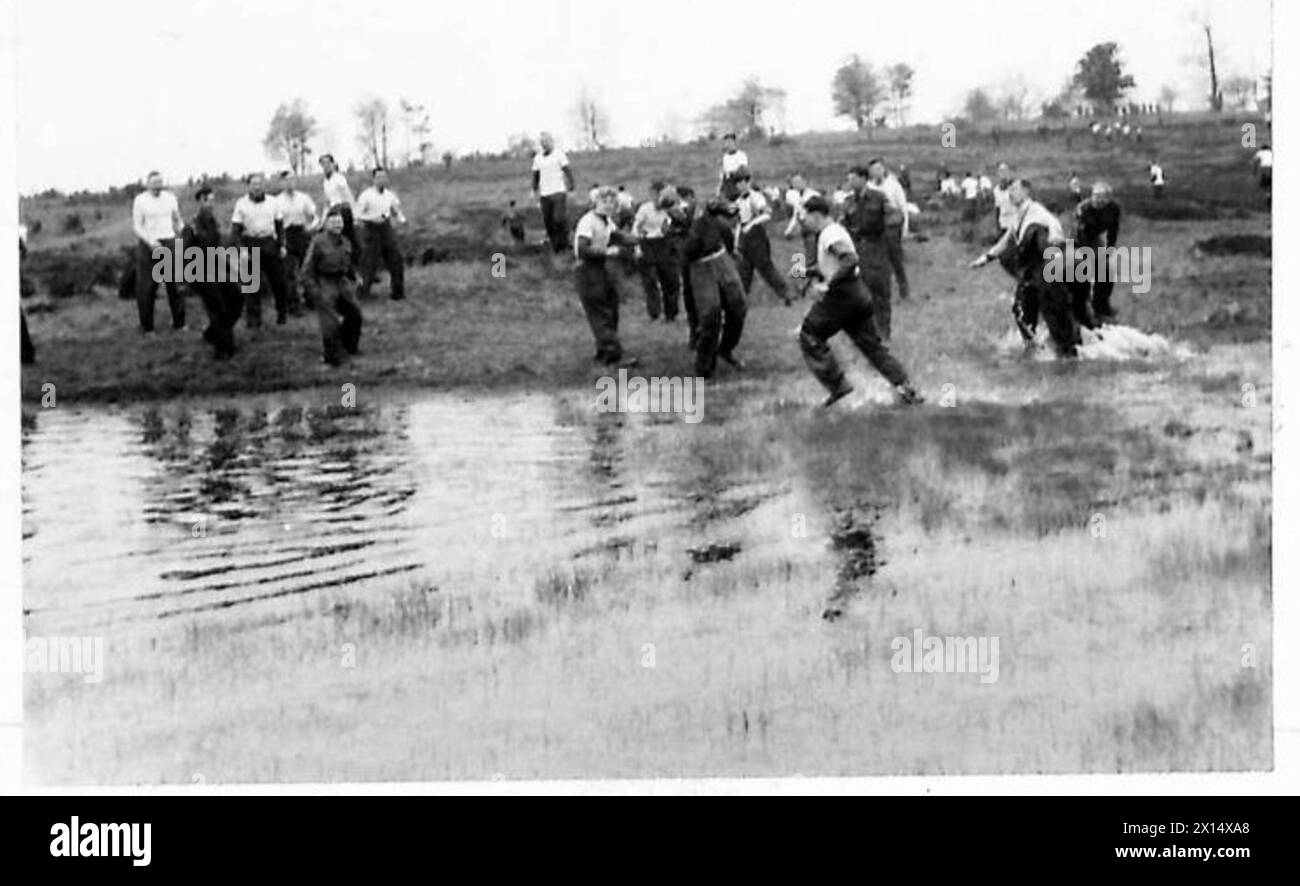 TACTICAL FOOTBALL - A good kick sends the ball into waterlogged ground ...