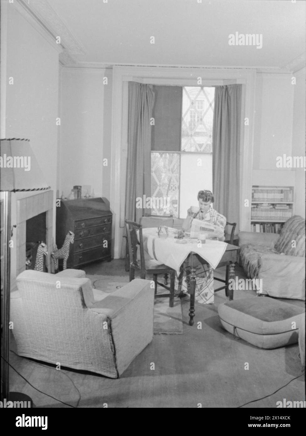 Mrs Olive Day has breakfast in her South Kensington home, London, 1941 ...