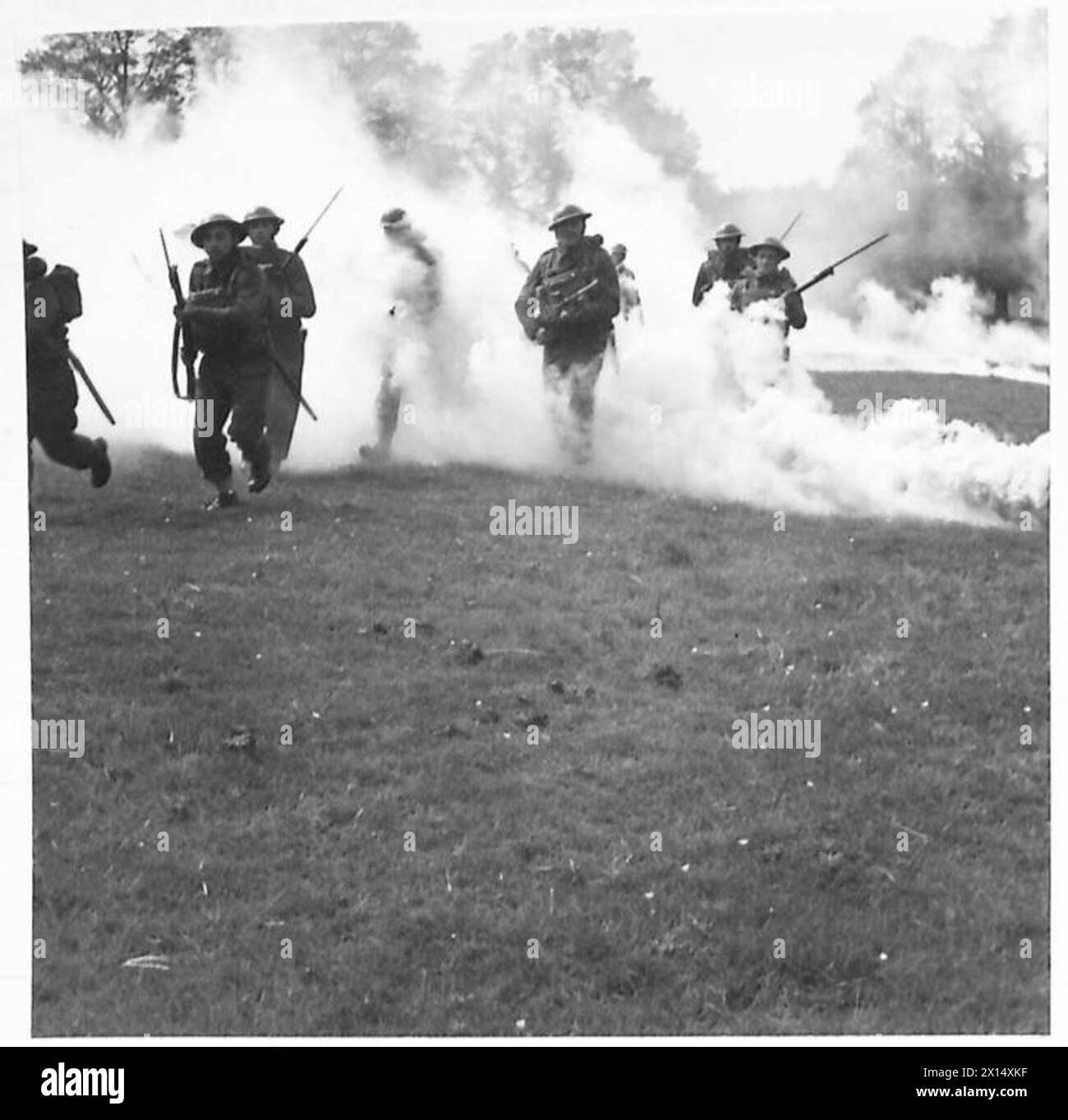 Czech infantry troops advance with fixed bayonets through a smoke ...