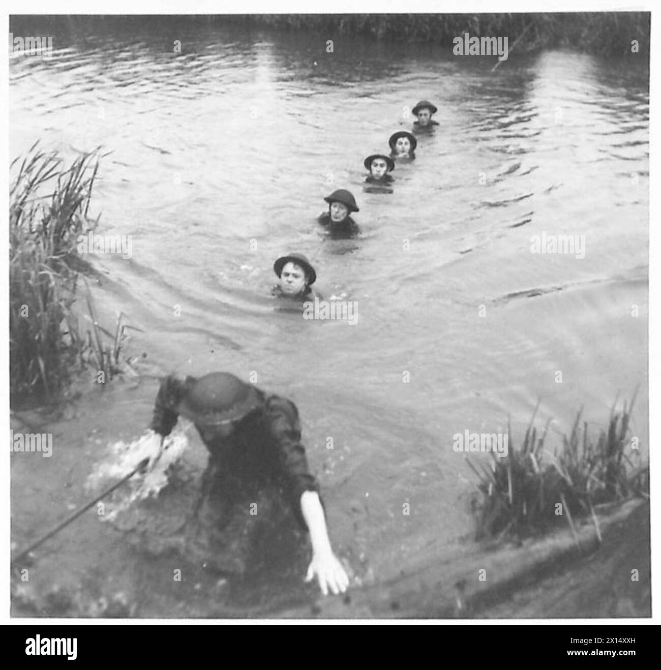 HOME GUARDS SWIM RIVER - The platoon of Home Guards struggling across ...