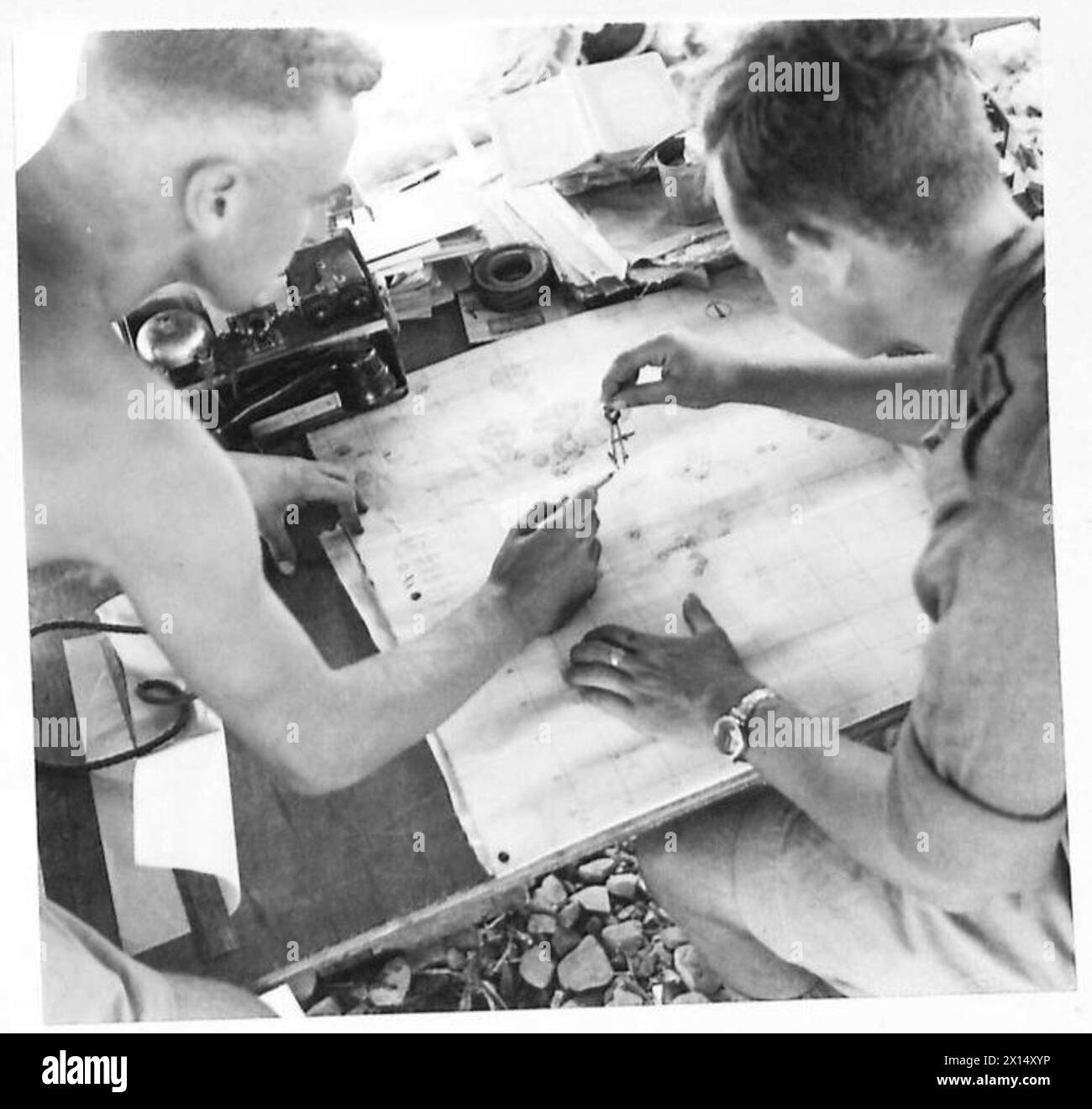 INVASION OF SICILY SOUND RANGING RECORDER - At work on a chart of ...