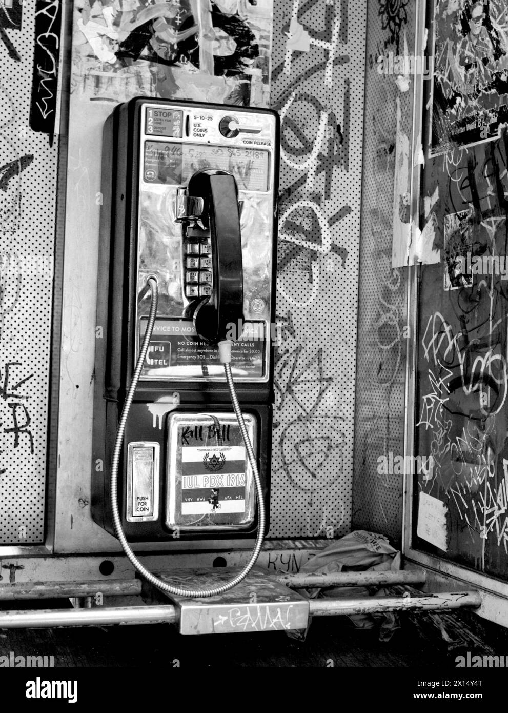 Graffiti covers a coin operated phone booth on Portland, Oregon Stock ...