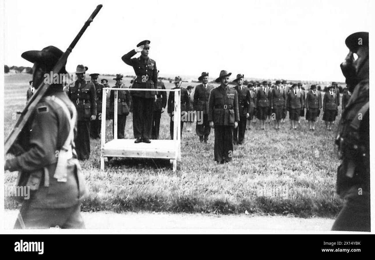 The King salutes the Australian Imperial Force during a march past at ...