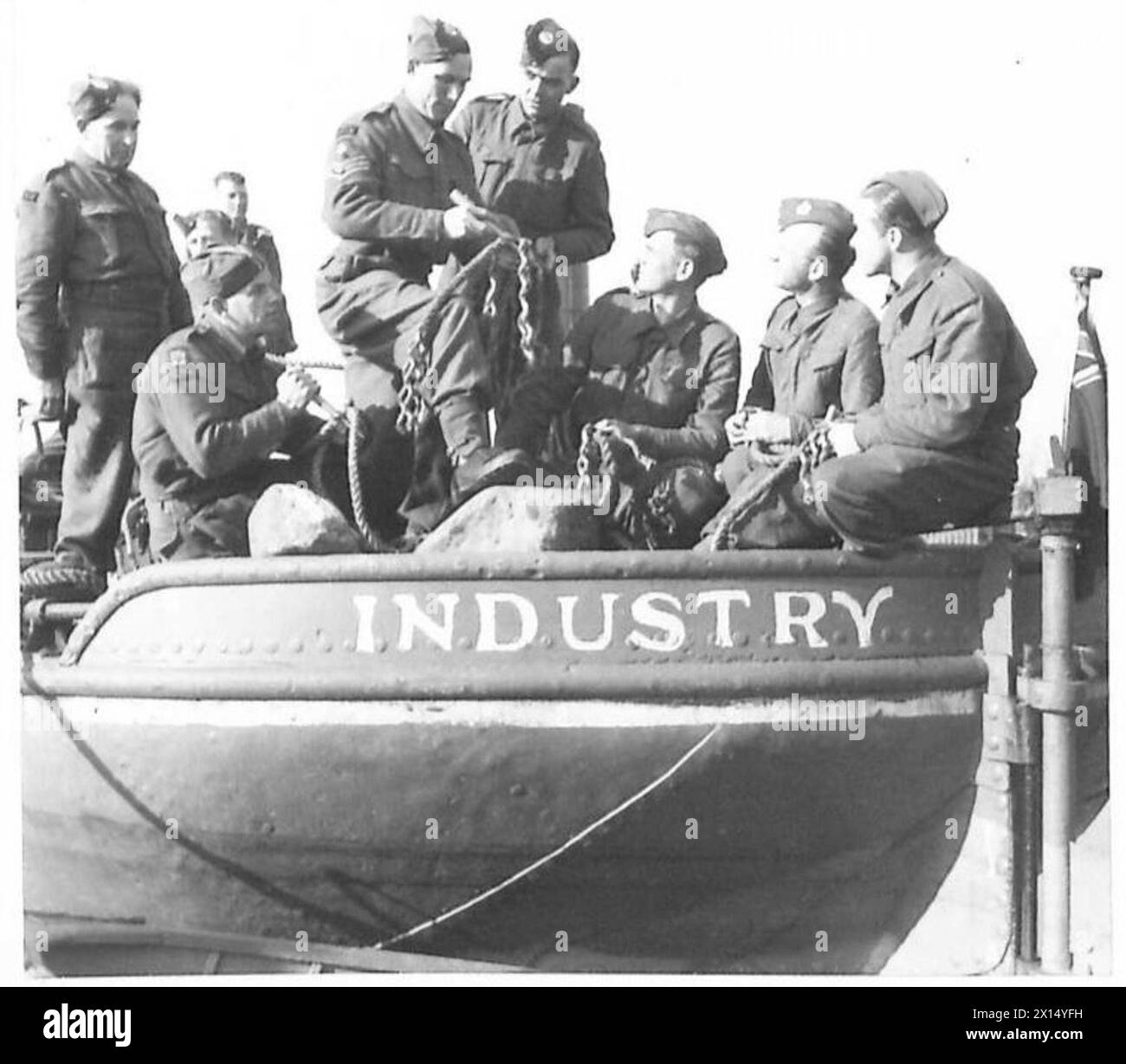 Crew demonstrate rope handling and splicing techniques aboard the barge ...