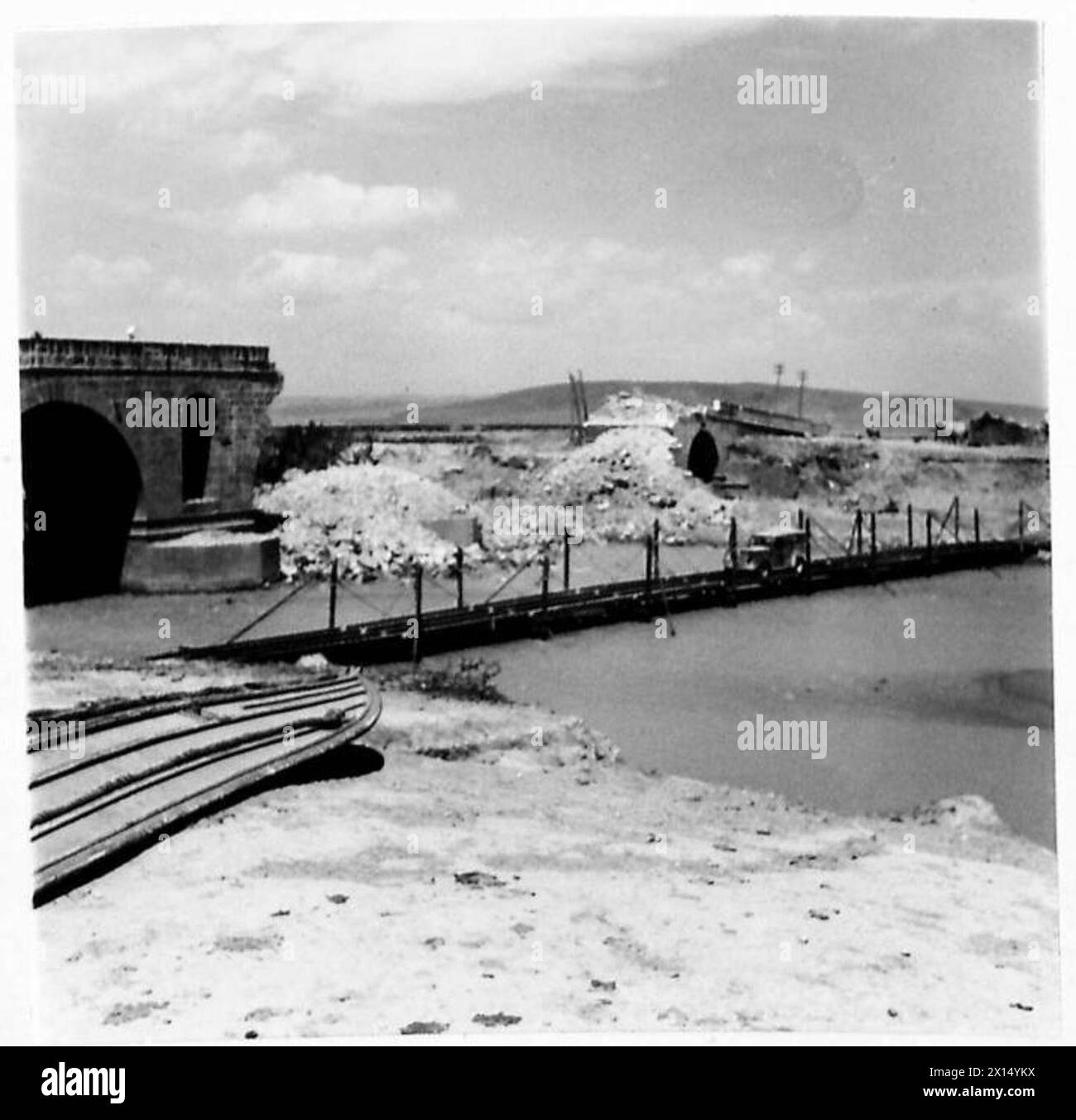 BRIDGING THE GAPS - Beside the blown up bridge at Protville, another ...