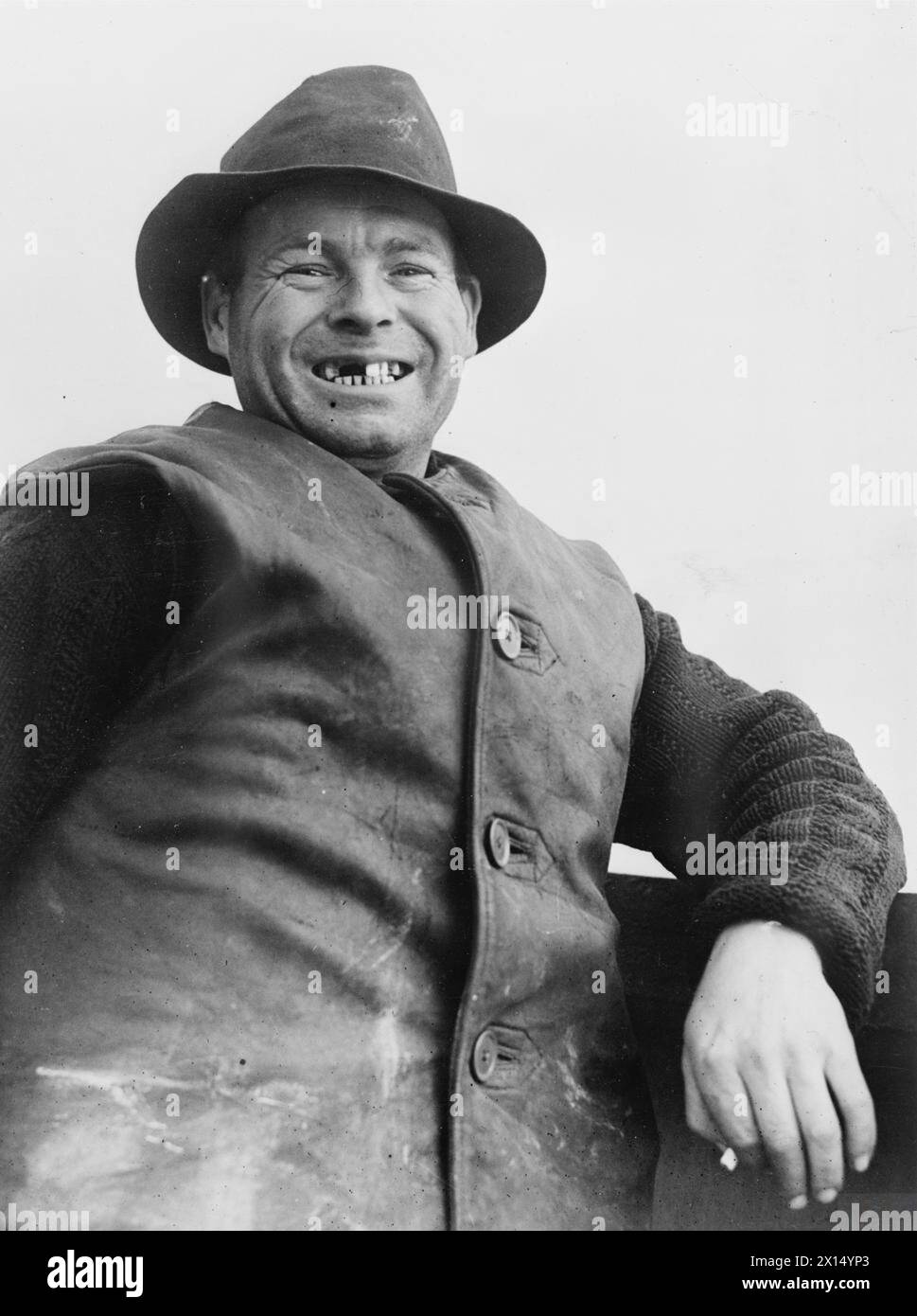 H. M. Pegler of Ilford is seen aboard the British merchant ship Empire ...