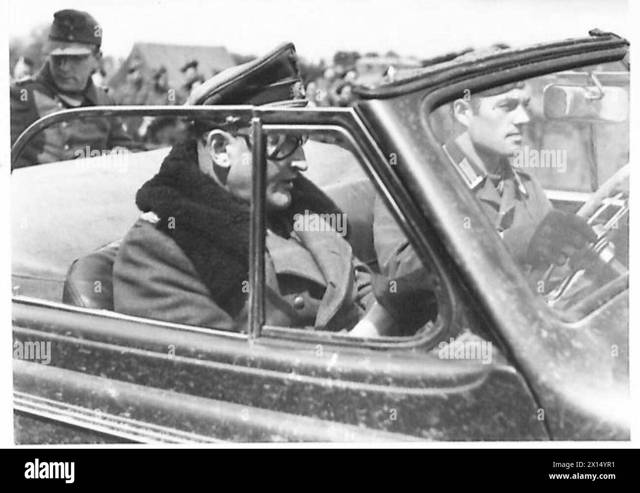 General Roth of North-West German forces is seated in his car after ...