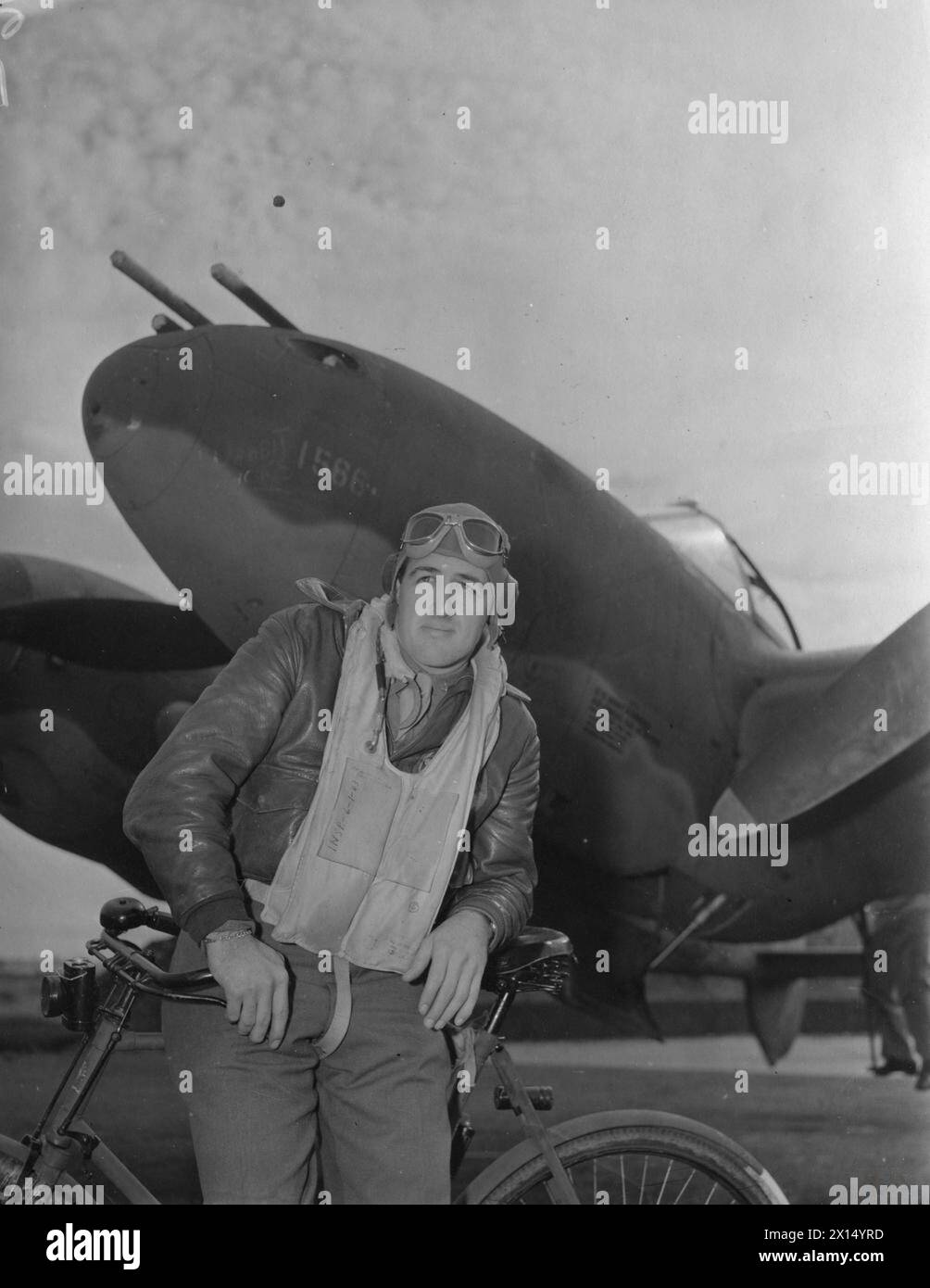 Captain Delynn Anderson of the 20th Fighter Group stands with a bicycle ...
