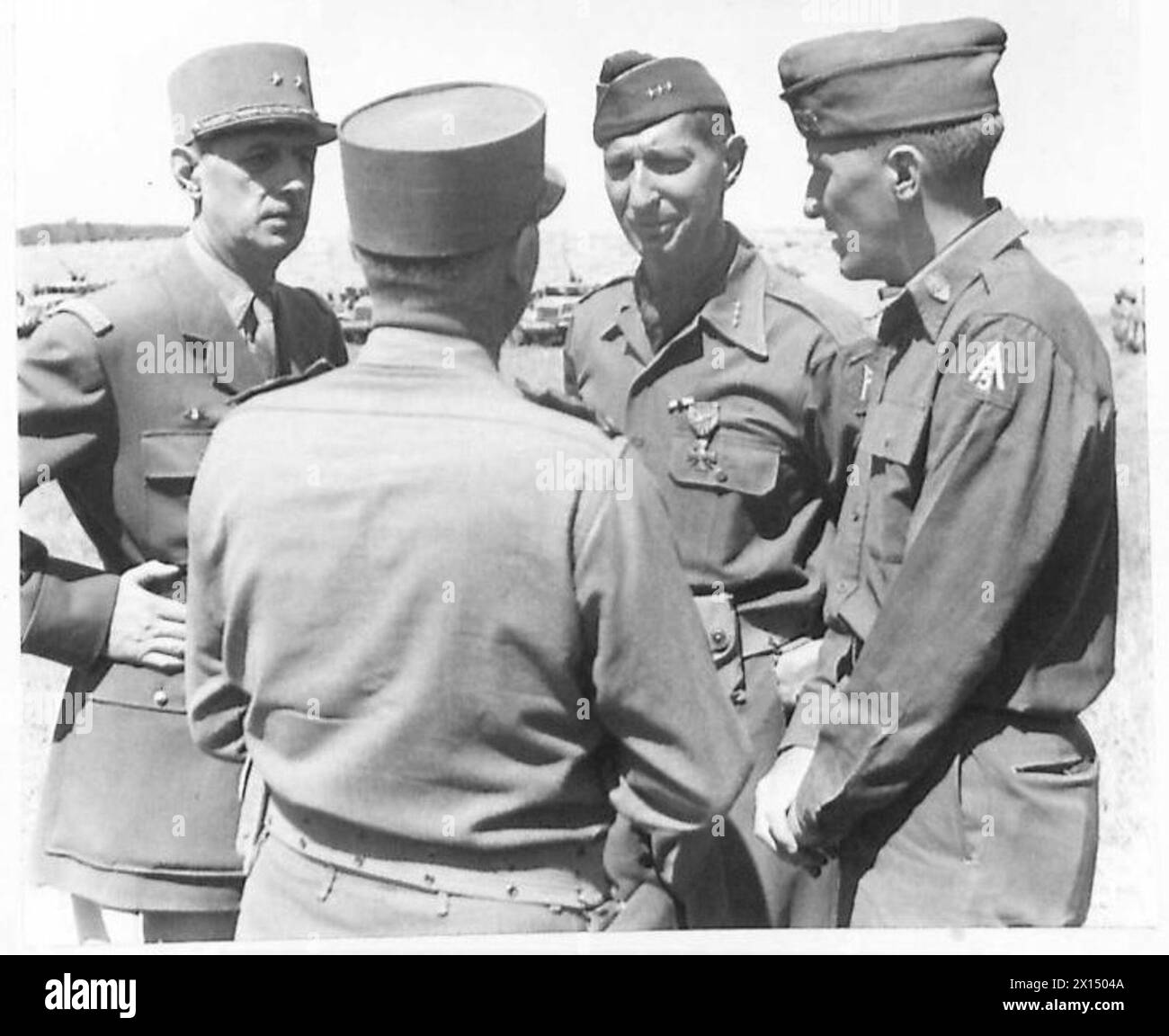 General de Gaulle, General Clark, General Juin, and an American officer ...