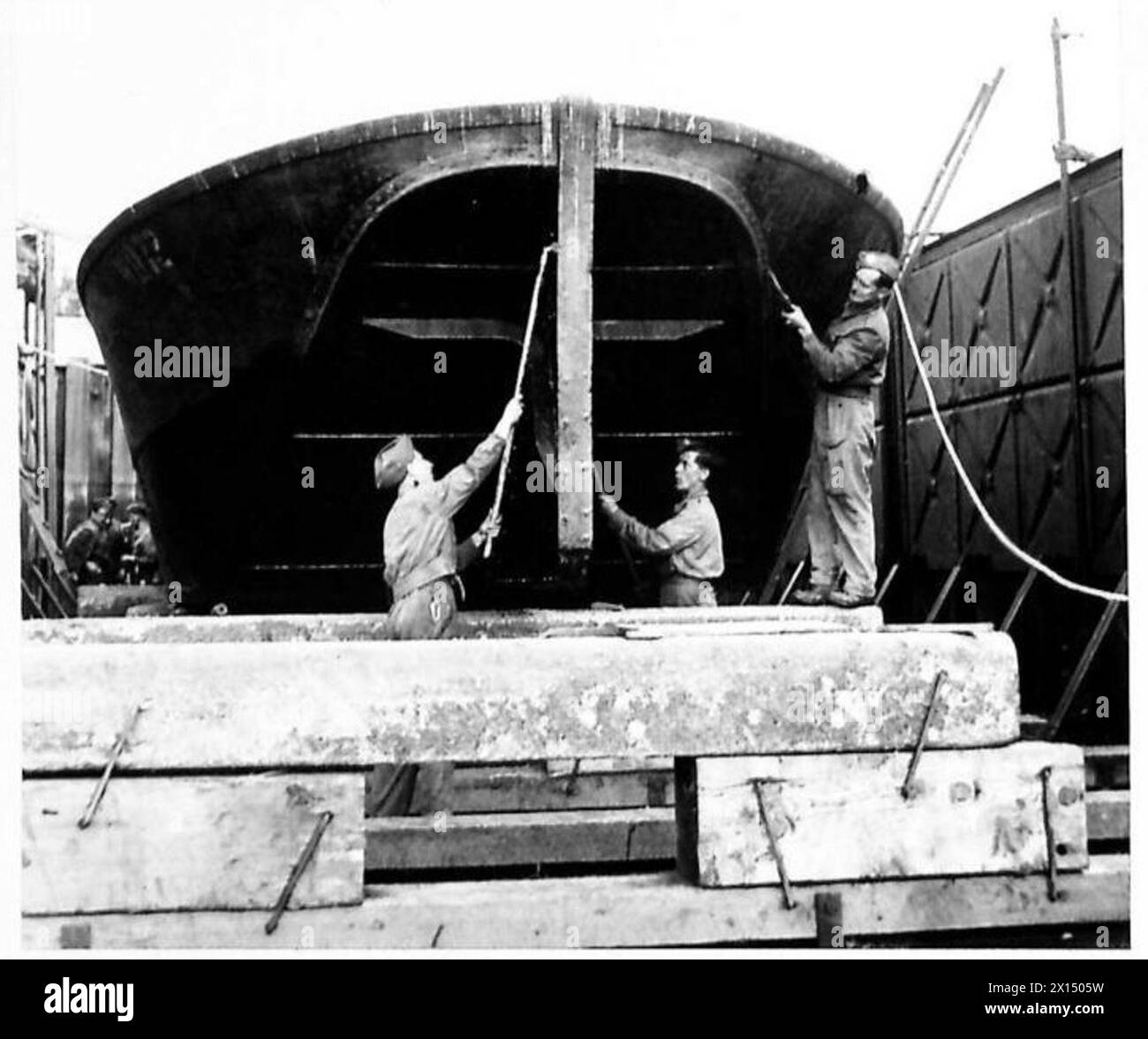 A barge is positioned in a floating dry dock at Garelochhead, showing ...