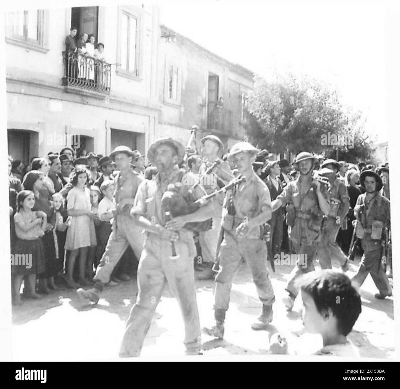 Villagers cheer British troops passing through San Onofrio, led by a ...