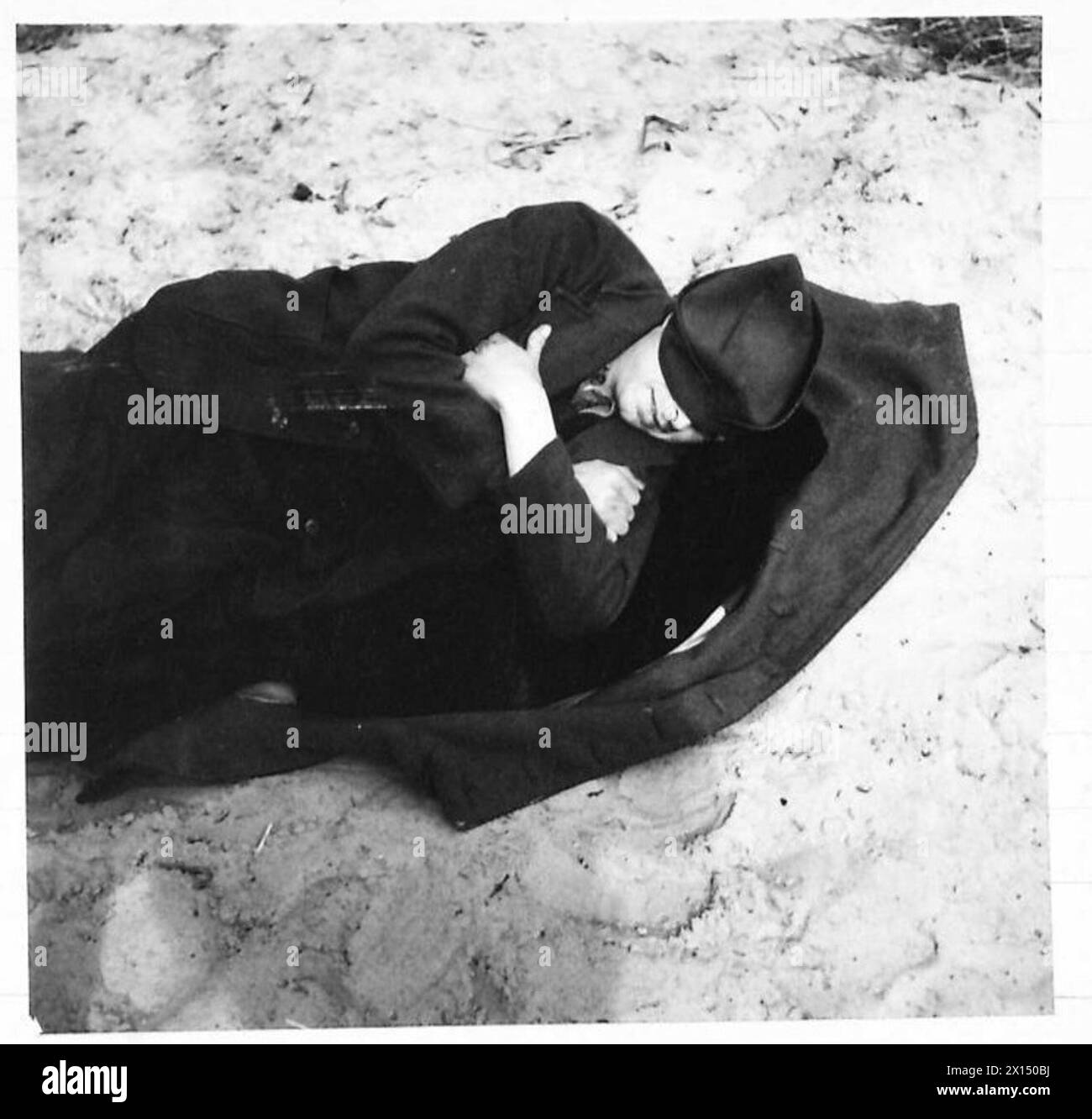 FREED FORCED LABOURERS - A French soldier takes a nap after being freed ...