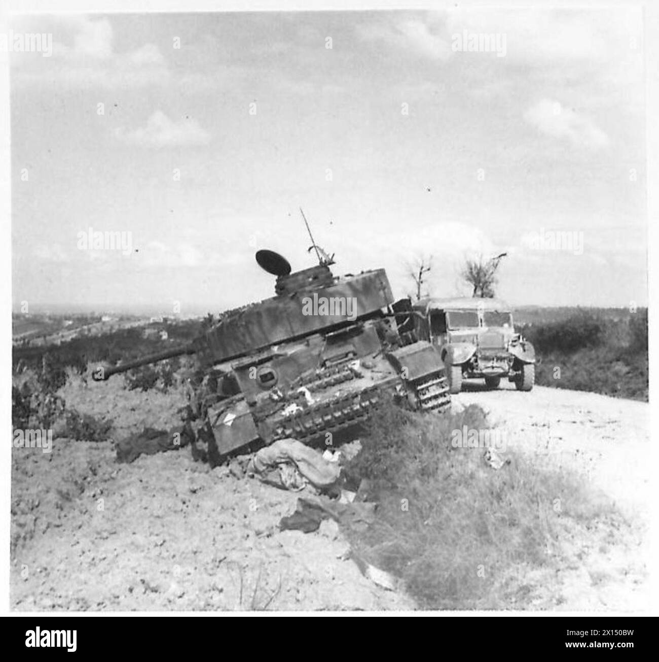 A captured enemy tank is positioned on the roadside near the River ...
