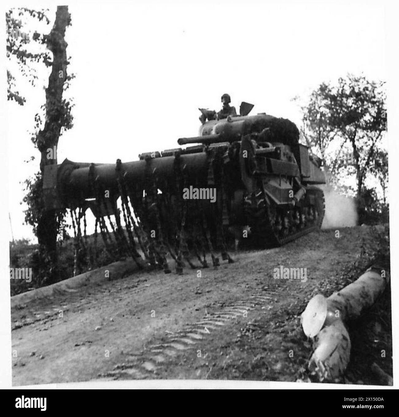 OUR ARMOUR CROSSES THE ORNE BRIDGE - A Flail tank making its way with ...