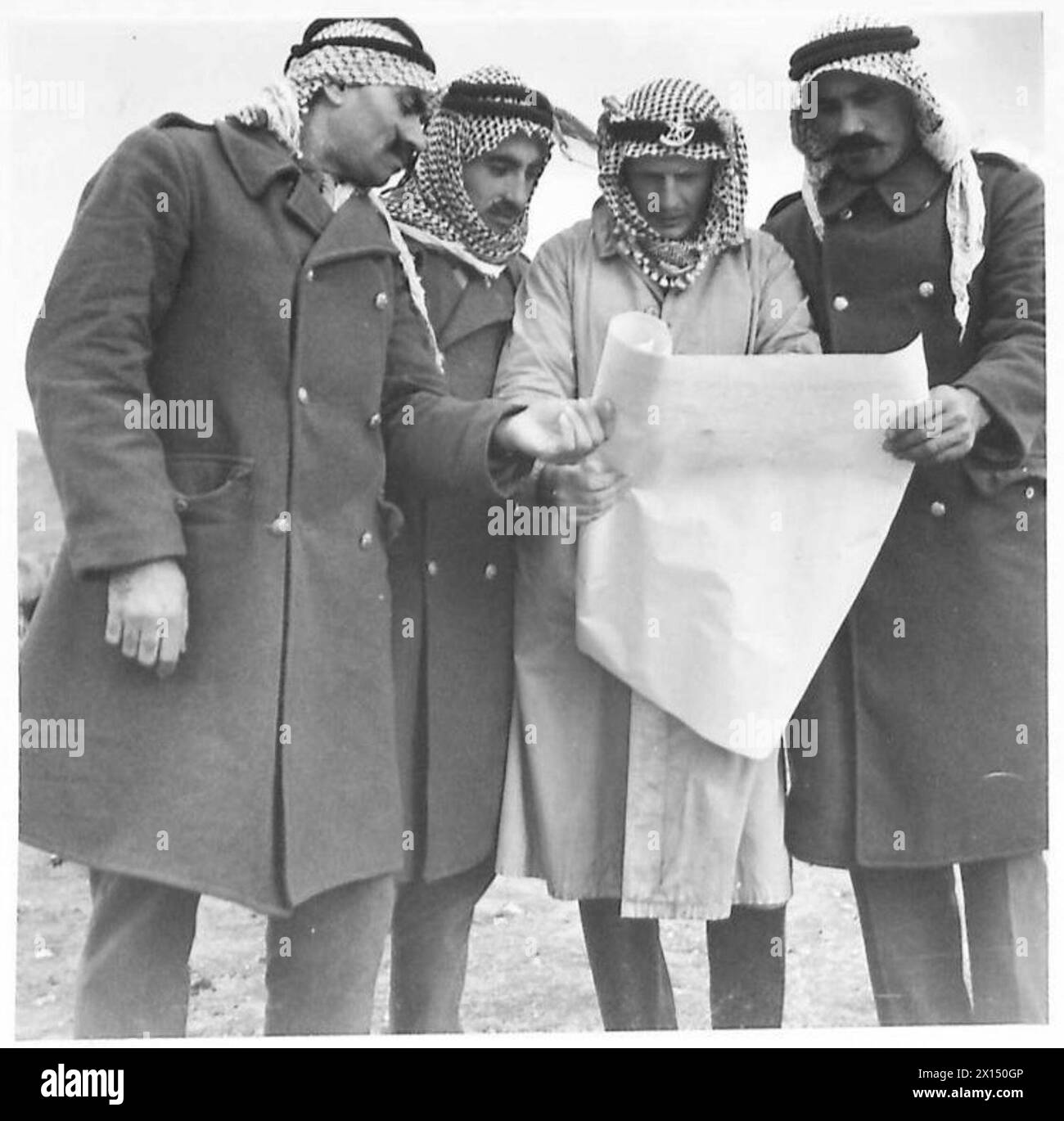 THE DRUSE REGIMENT - A Squadron Leader (in light coat) looking at a map ...