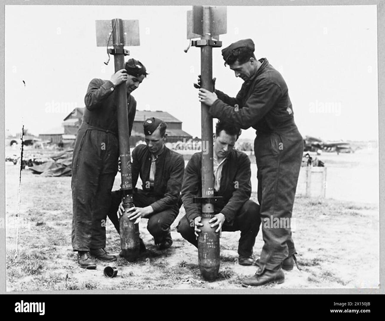 Armourers assemble rocket projectiles for Typhoon aircraft used in RAF ...