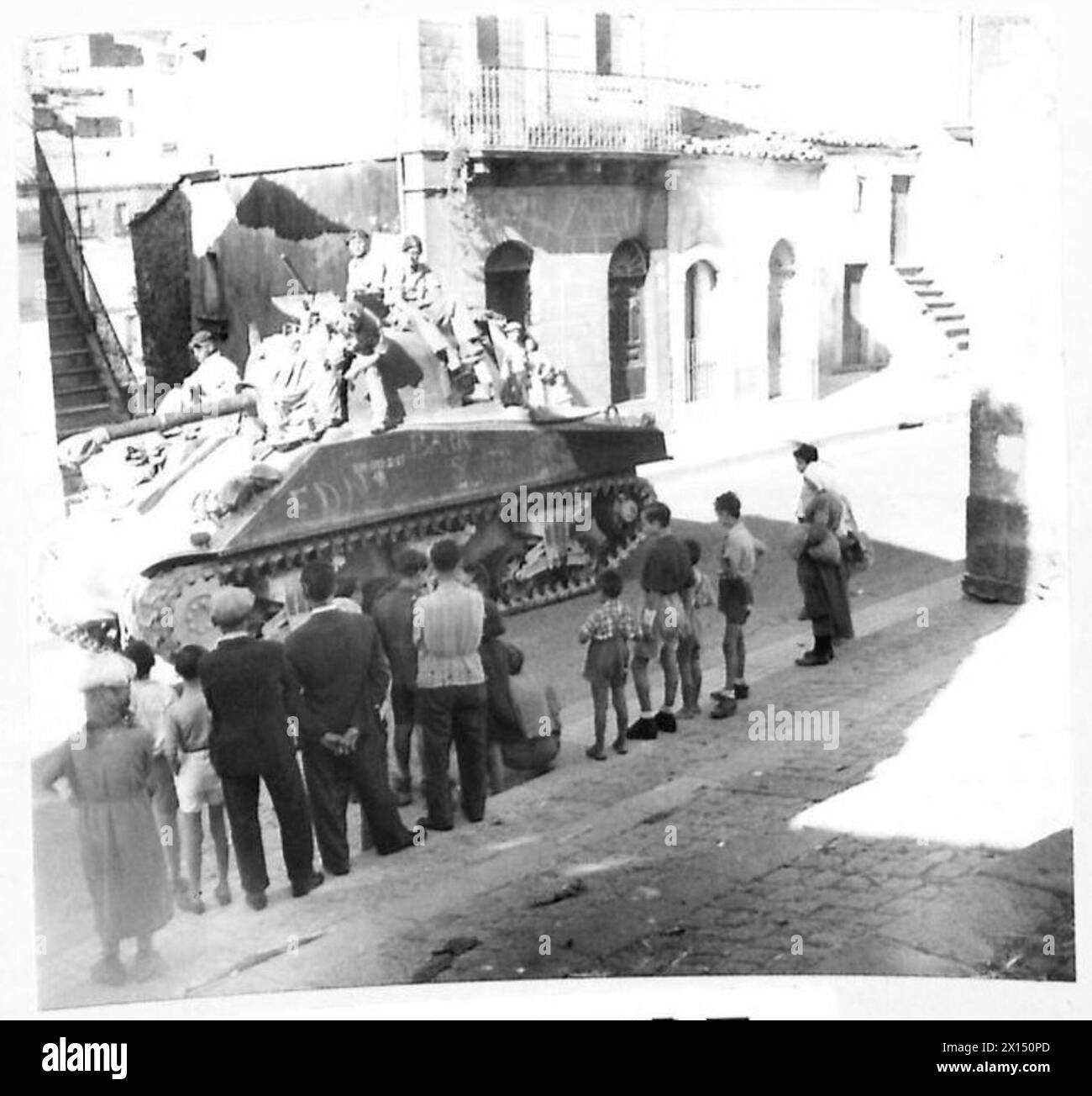 Heavy Sherman tanks move through towns and mountain roads in Sicily ...