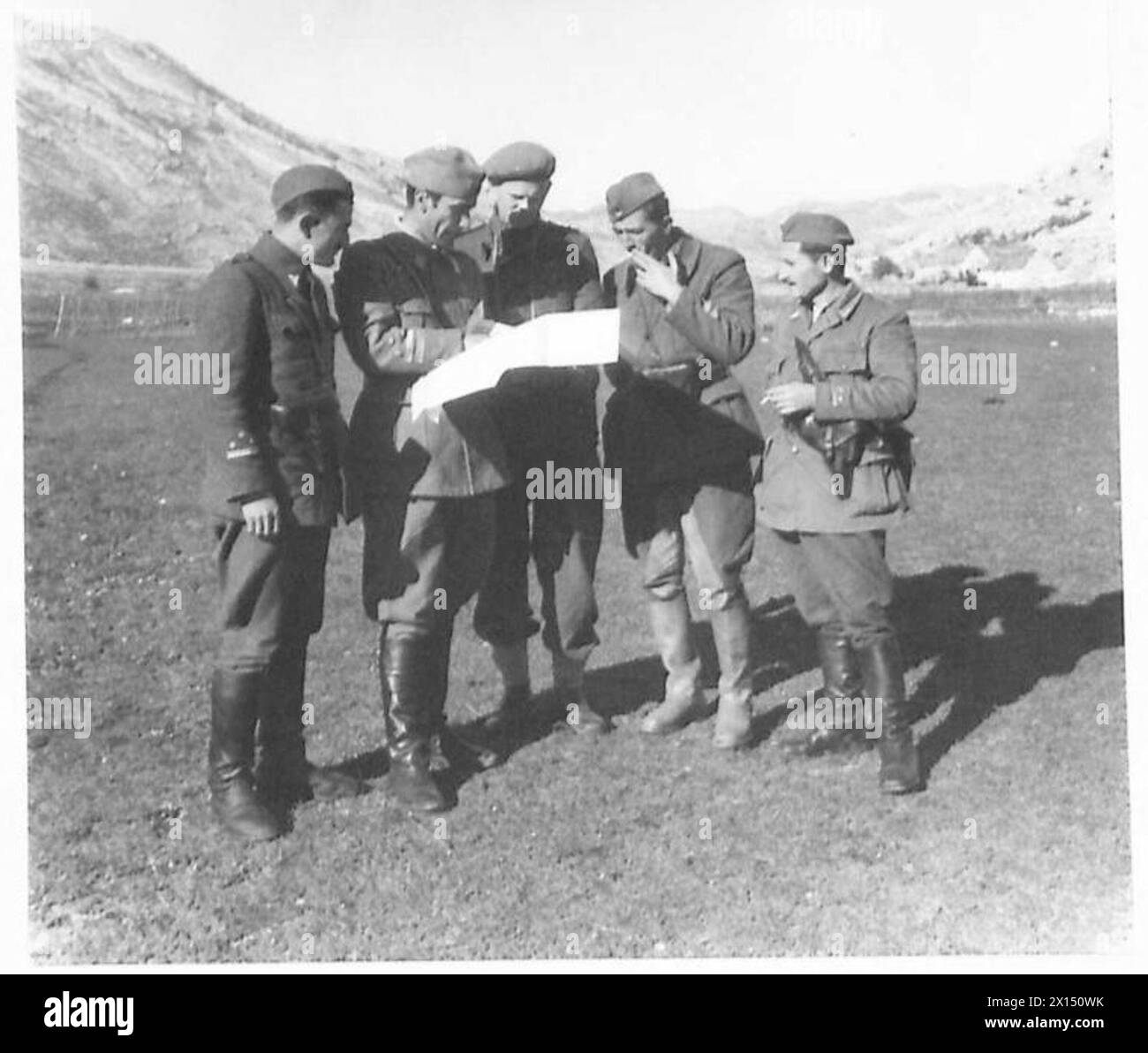Colonel Babic and his staff, including Capt. Bozidar Jovanovic, Capt. J.A. Earle, and Major ...